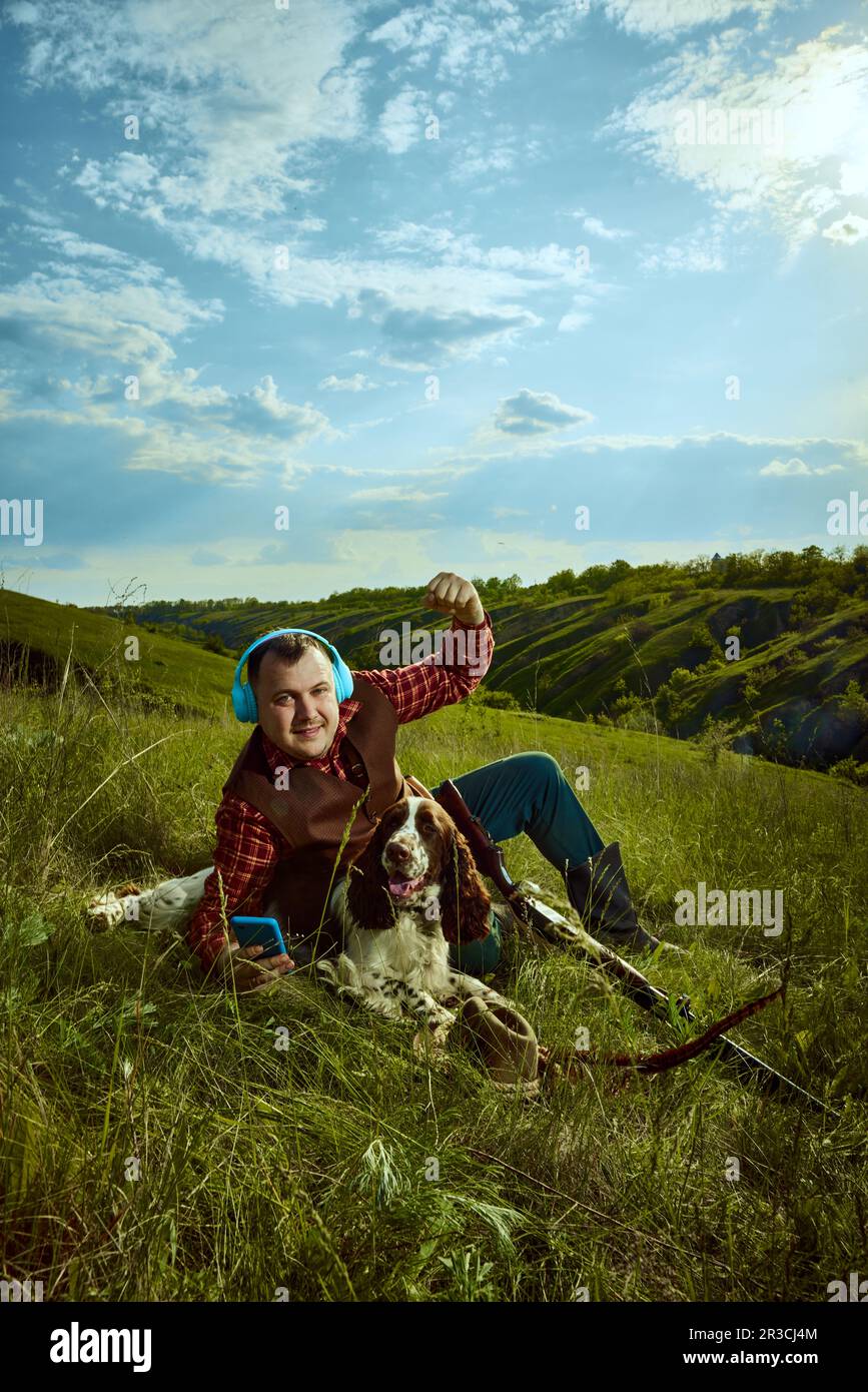 Portrait with happy man and his dog English springer spaniel sitting on ...