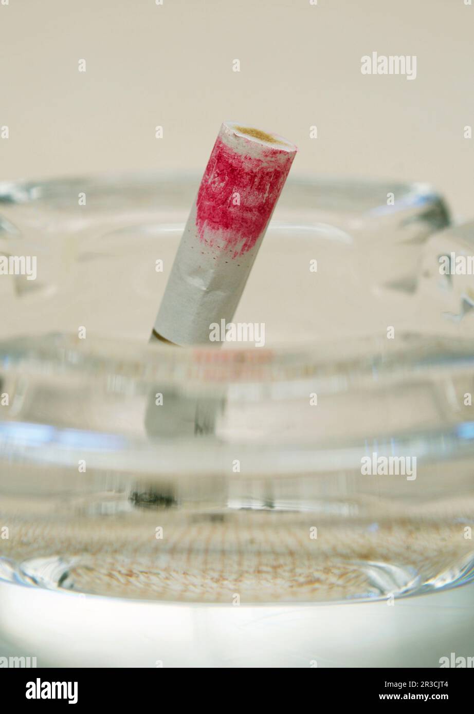 cigarette stub with lipstick mark standing in ashtray Stock Photo - Alamy