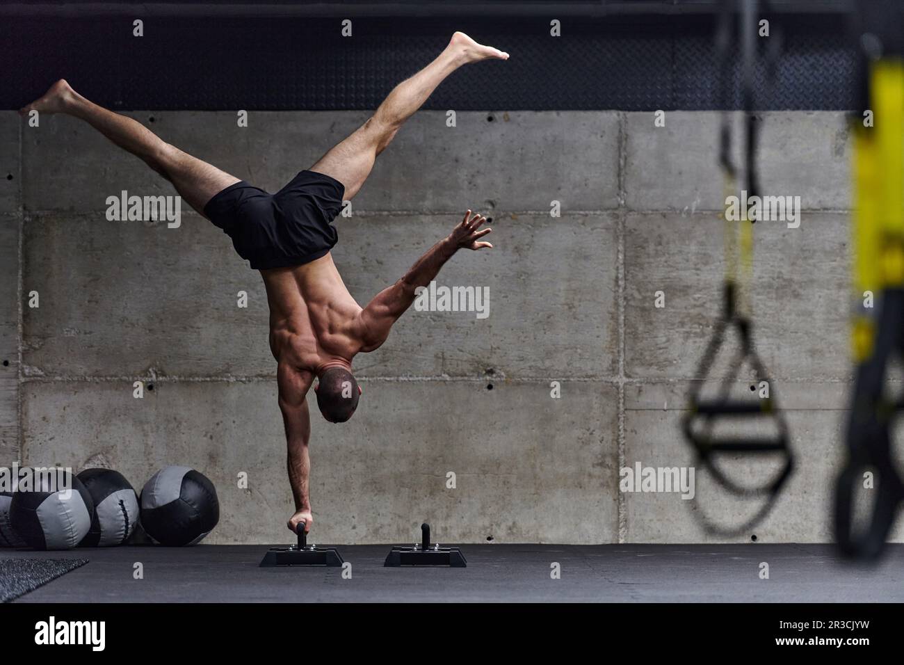 A muscular man in a handstand position, showcasing his exceptional ...