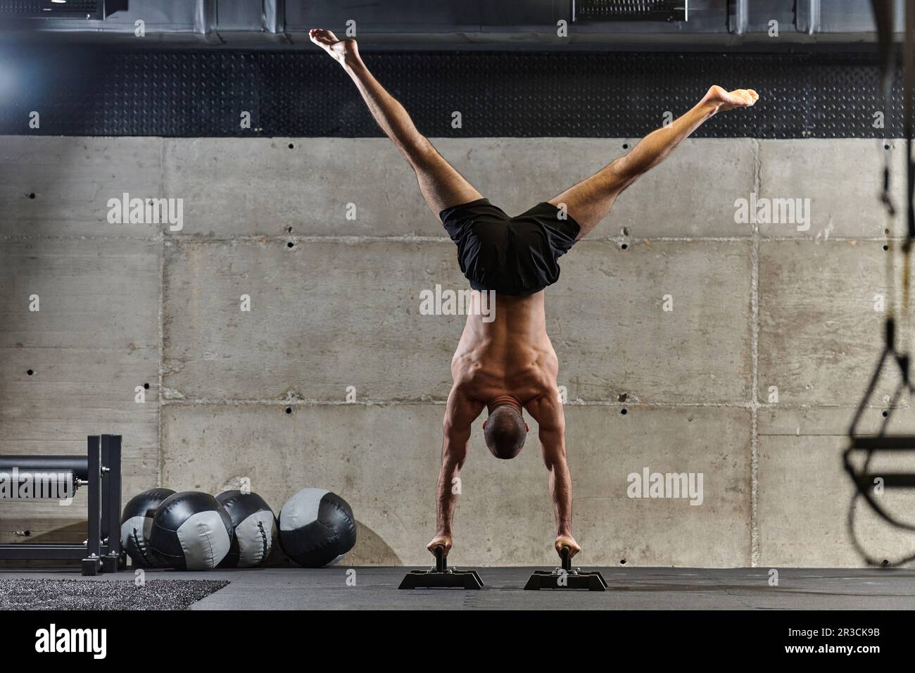 A muscular man in a handstand position, showcasing his exceptional ...