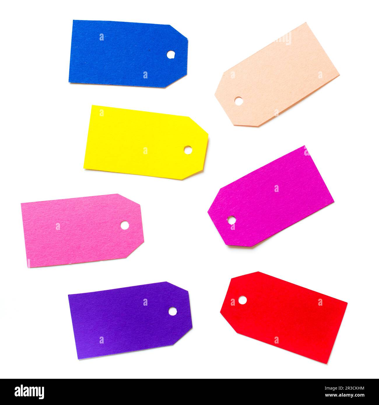The cardboard tags of different colors with copy space for a holiday ...