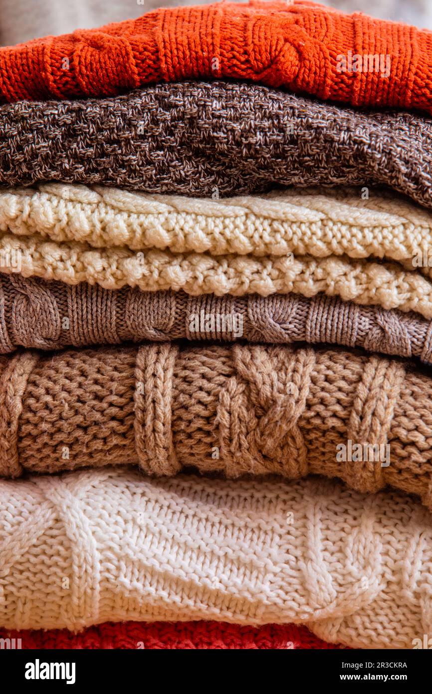 Pile of woolen clothes close up as a background Stock Photo - Alamy