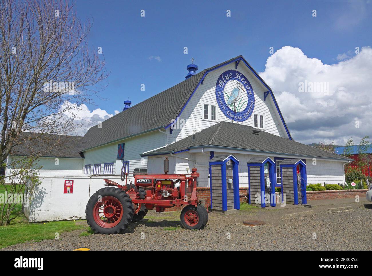 An ancient tractor marks the entrance to the Blue Heron Cheese Factory ...