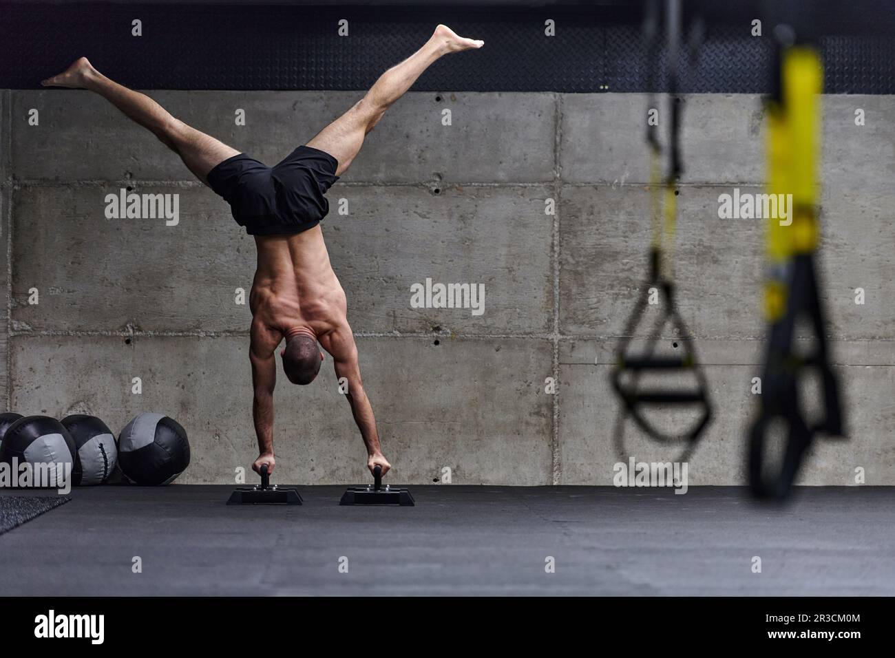 A muscular man in a handstand position, showcasing his exceptional ...