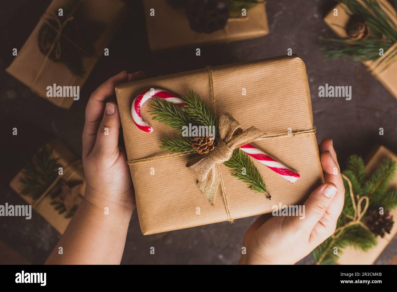 Simple wrapping xmas gift with candy cane Stock Photo - Alamy