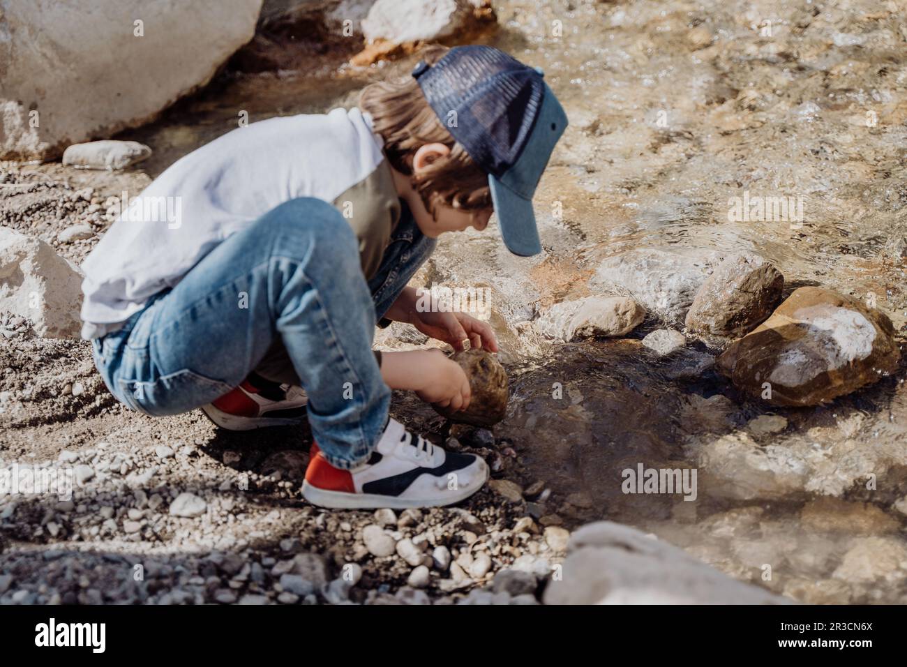 Kid throwing rock hi-res stock photography and images - Alamy