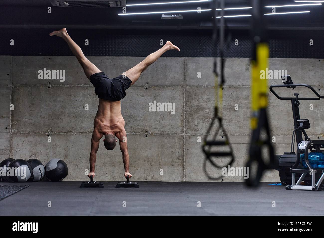 A muscular man in a handstand position, showcasing his exceptional ...