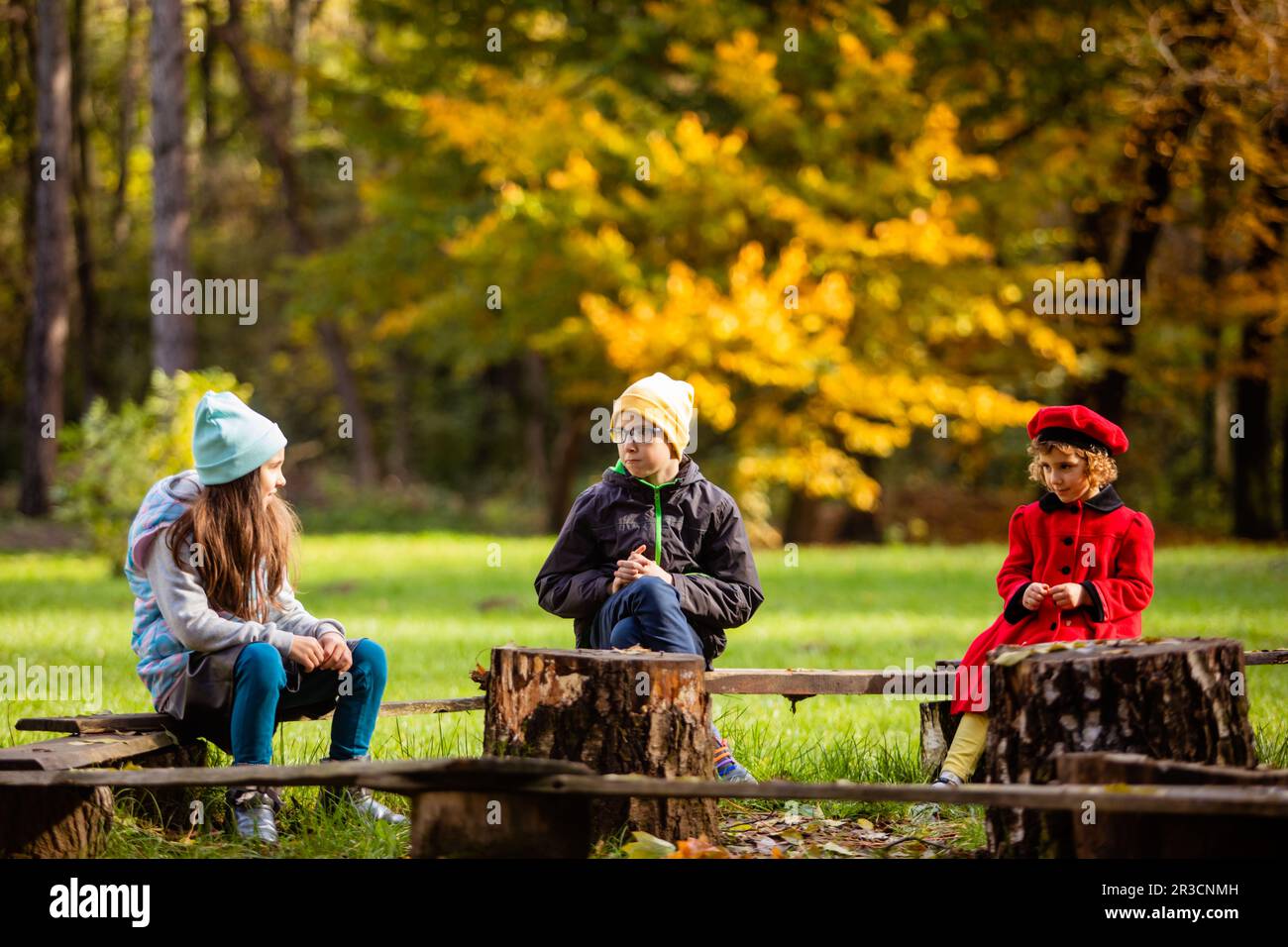 The children communicate at a distance outdoors during a pandemic Stock ...