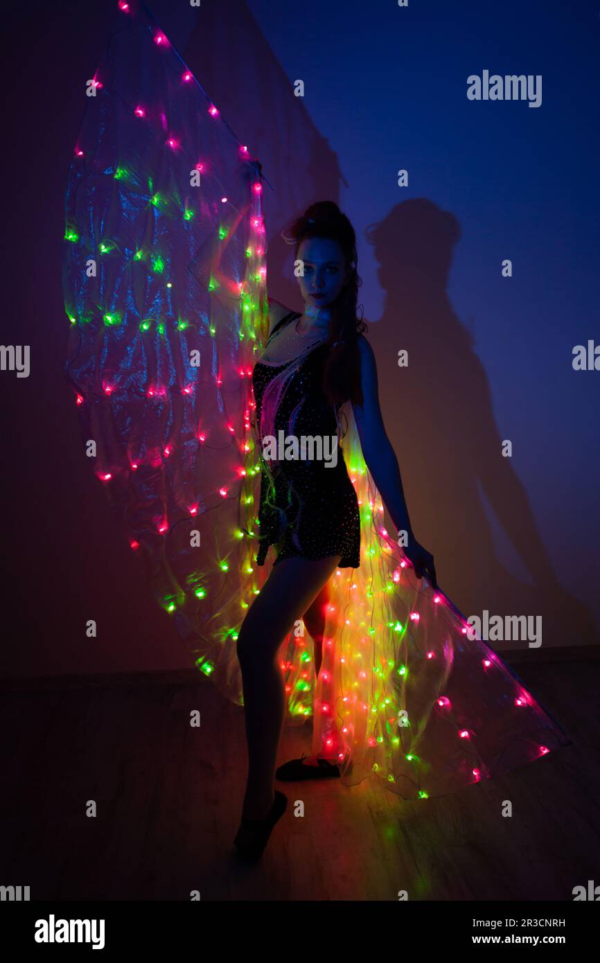 Magic performance in costume with many lamps Stock Photo - Alamy