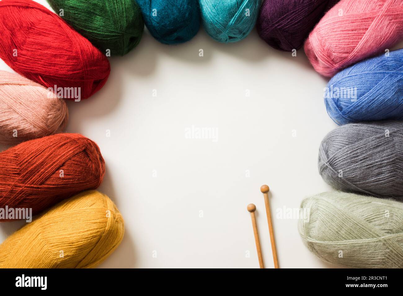 Top view of scattered colored yarn balls on white background Stock ...