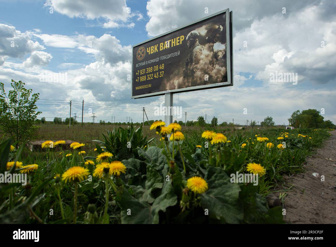 A billboard depicting Russian servicemen and an advertisement for a ...
