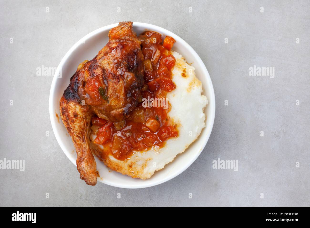 Traditional South African pap or maize meal with traditional sauce of ...