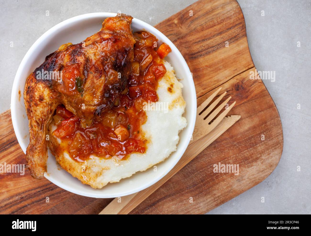 Traditional South African pap or maize meal with traditional sauce of ...