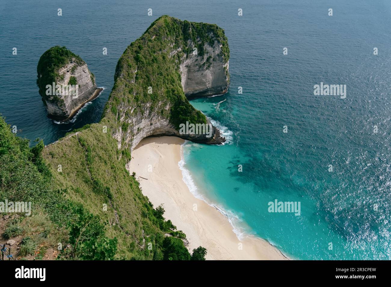 Green rock and blue ocean view point, view from above in Indonesia ...