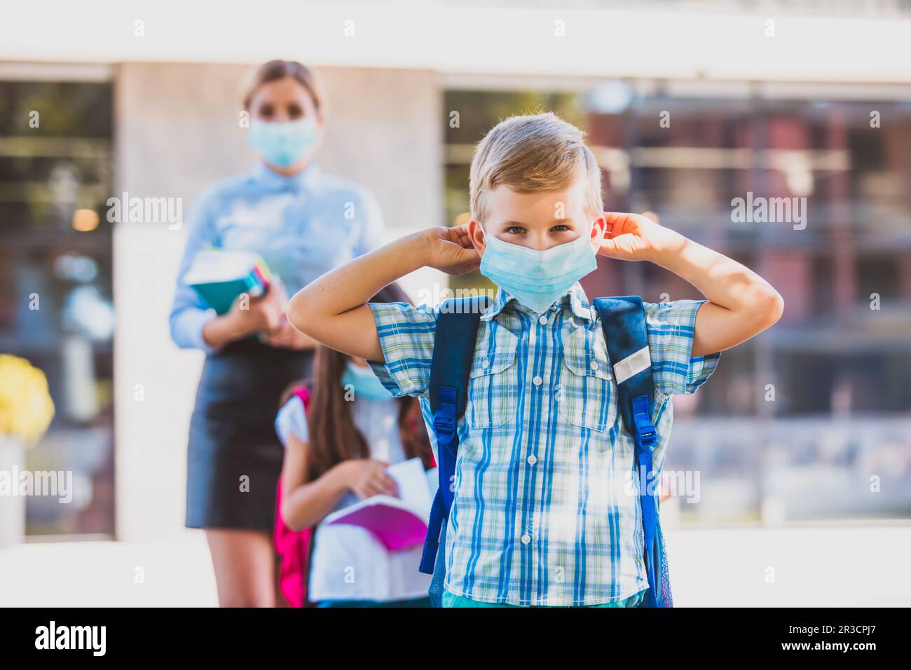 Kids learning to fix the mask at school Stock Photo - Alamy