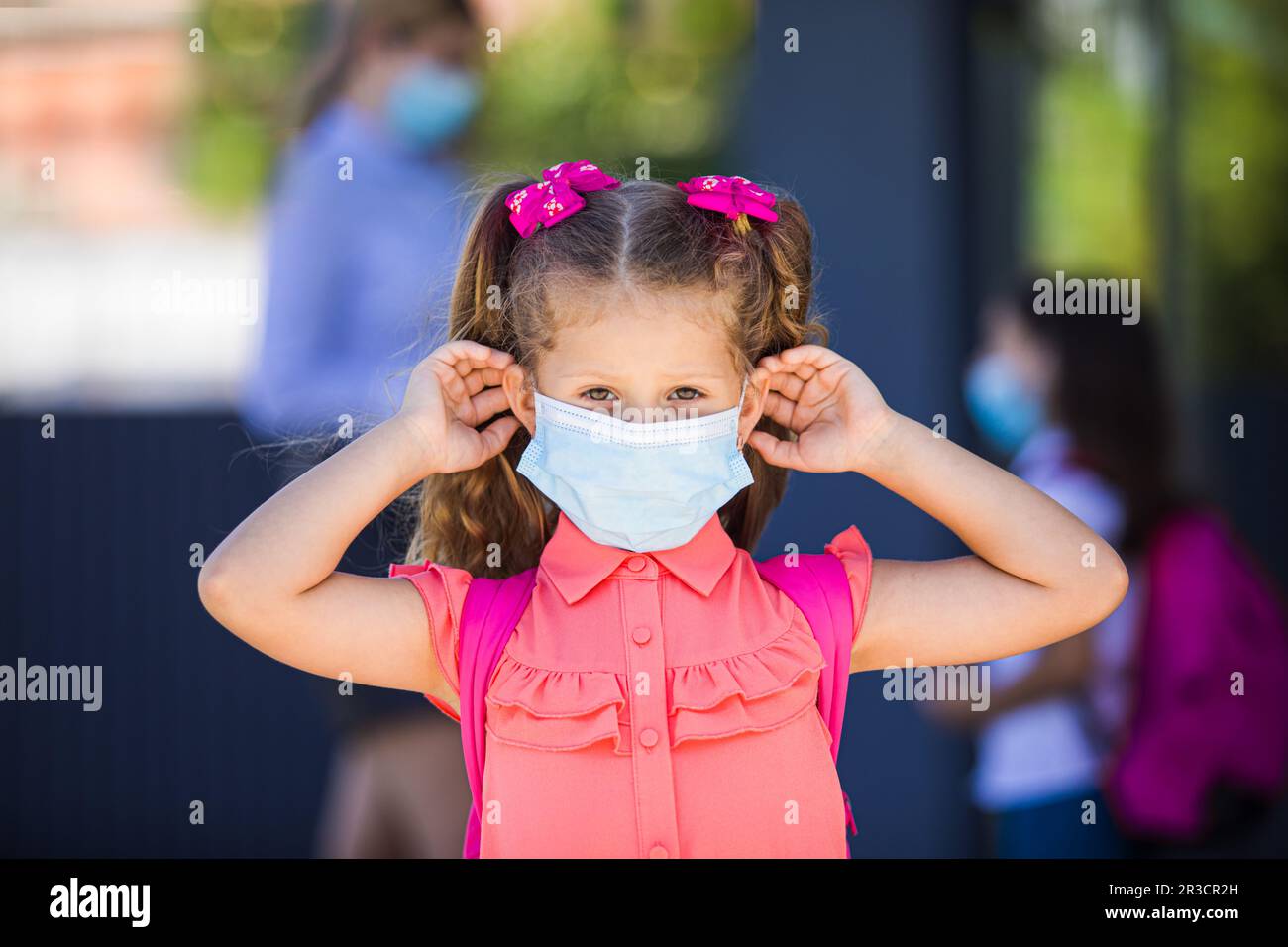 The little schoolgirl is ready to go to school during quarantine Stock ...