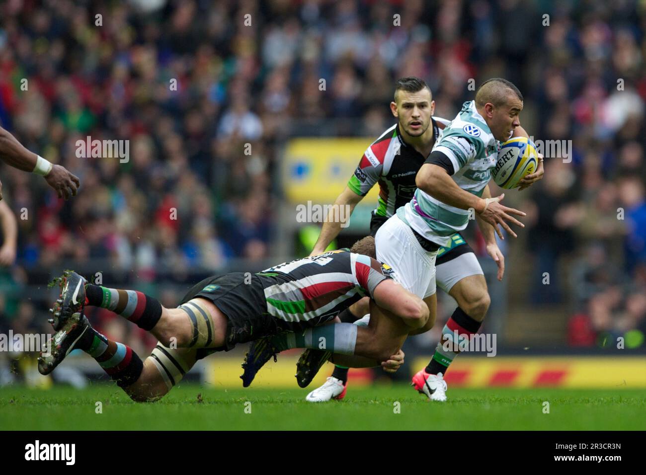 Jonathan Joseph of London Irish is tackled during the Aviva Premiership ...