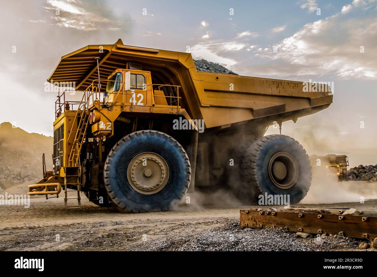 Mining dump trucks transporting Platinum ore for processing Stock Photo ...