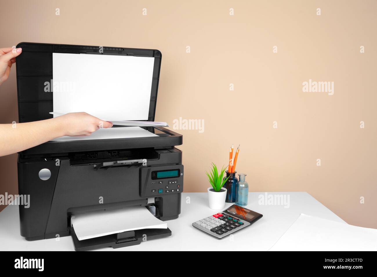 Woman using the printer to scanning and printing document Stock Photo ...