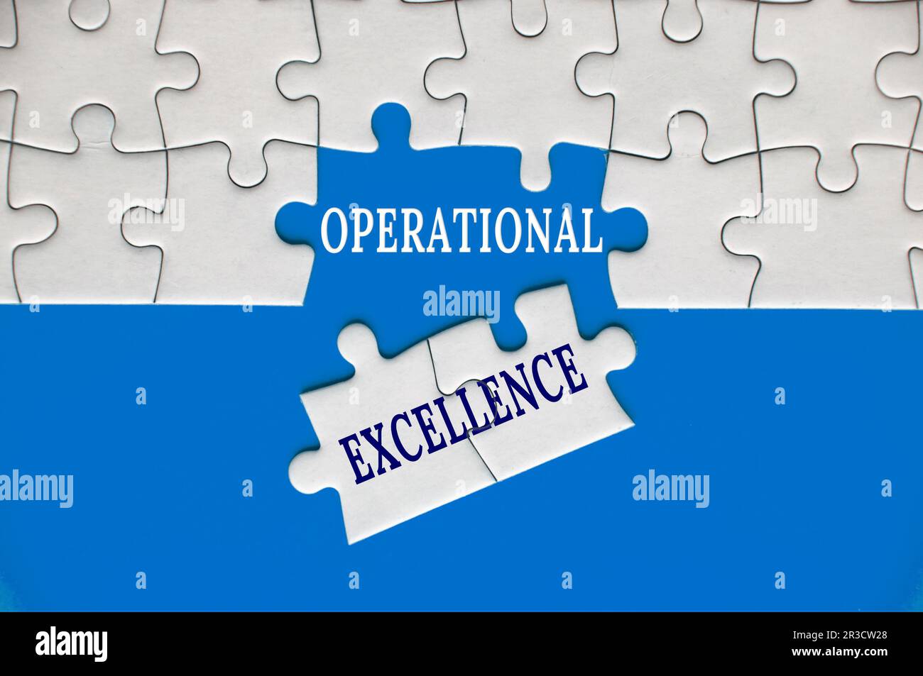 Operational Excellence text on missing jigsaw puzzle with blue cover ...