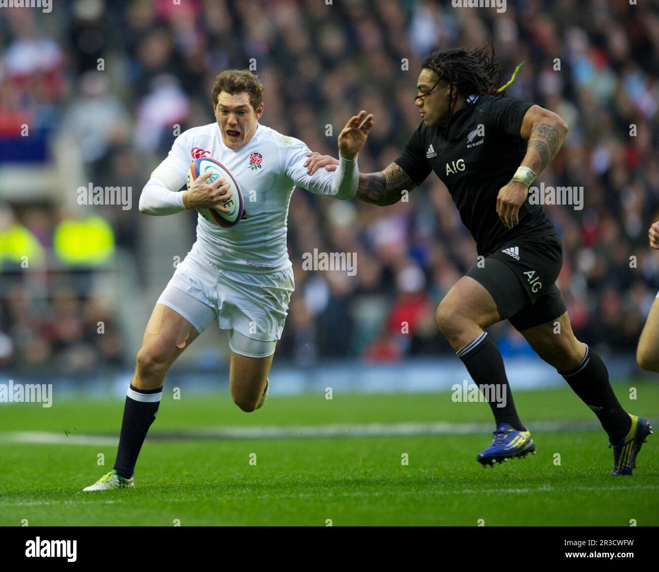 Alex Goode of England in action against Ma'a Nonu of New Zealand during ...