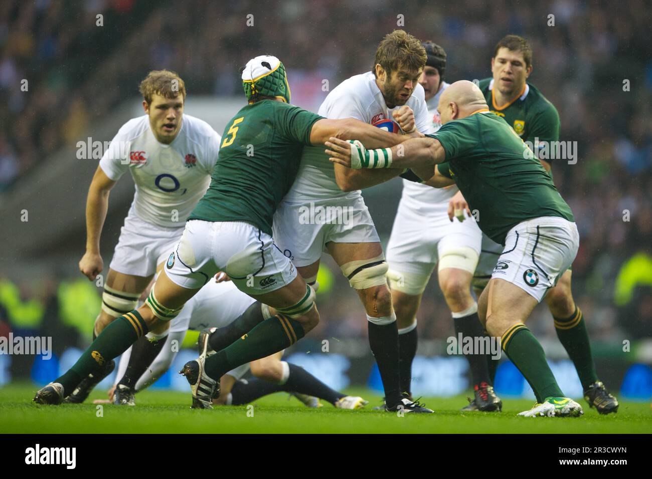 Geoff Parling of England is tackled by Juandré Kruger (left) and ...