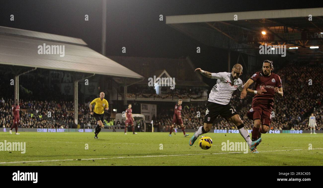 Fulham's Ashkan Dejagah battles with Newcastle United's Jonas Gutierrez ...