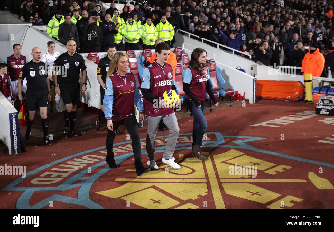 Bobby Moore's grandchildren walk out with the match ball. Poppy (L ...