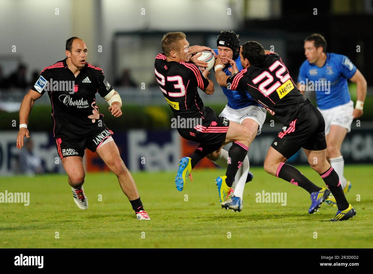 Isaac Boss of Leinster is tackled by Paul Warwick (left) and Julien ...