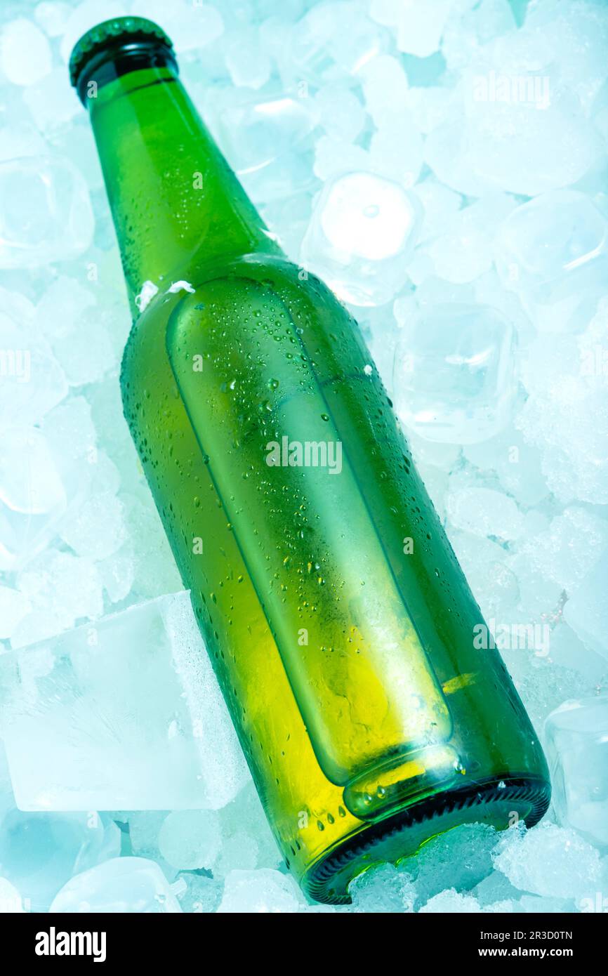 Bottle of green beer in very cold ice cubes Stock Photo - Alamy