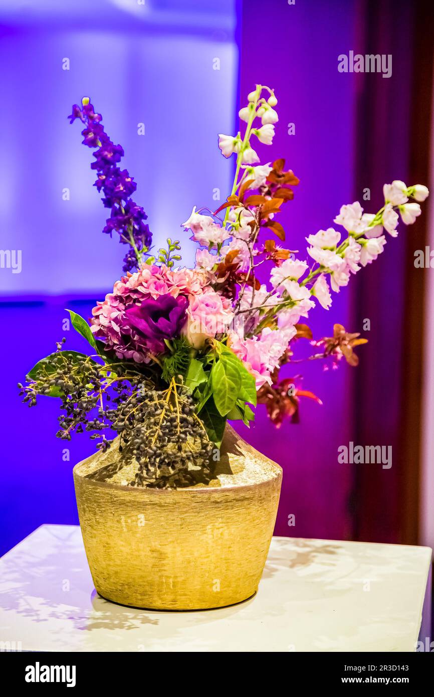 Flower table arrangement at corporate party event Stock Photo - Alamy