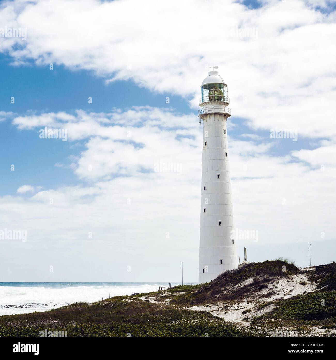 Lighthouse on a rugged coastline during the daytime Stock Photo - Alamy