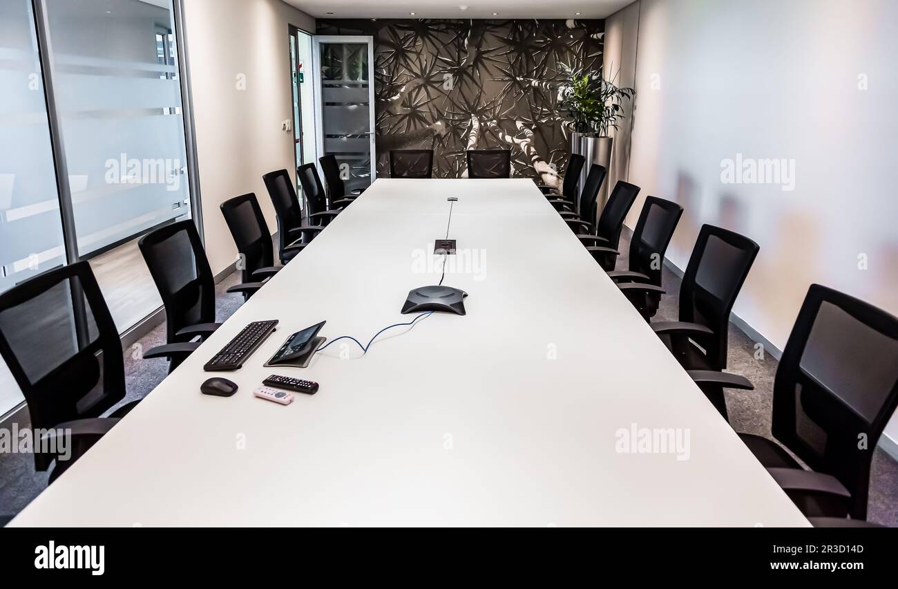 Empty modern boardroom table and chairs Stock Photo - Alamy