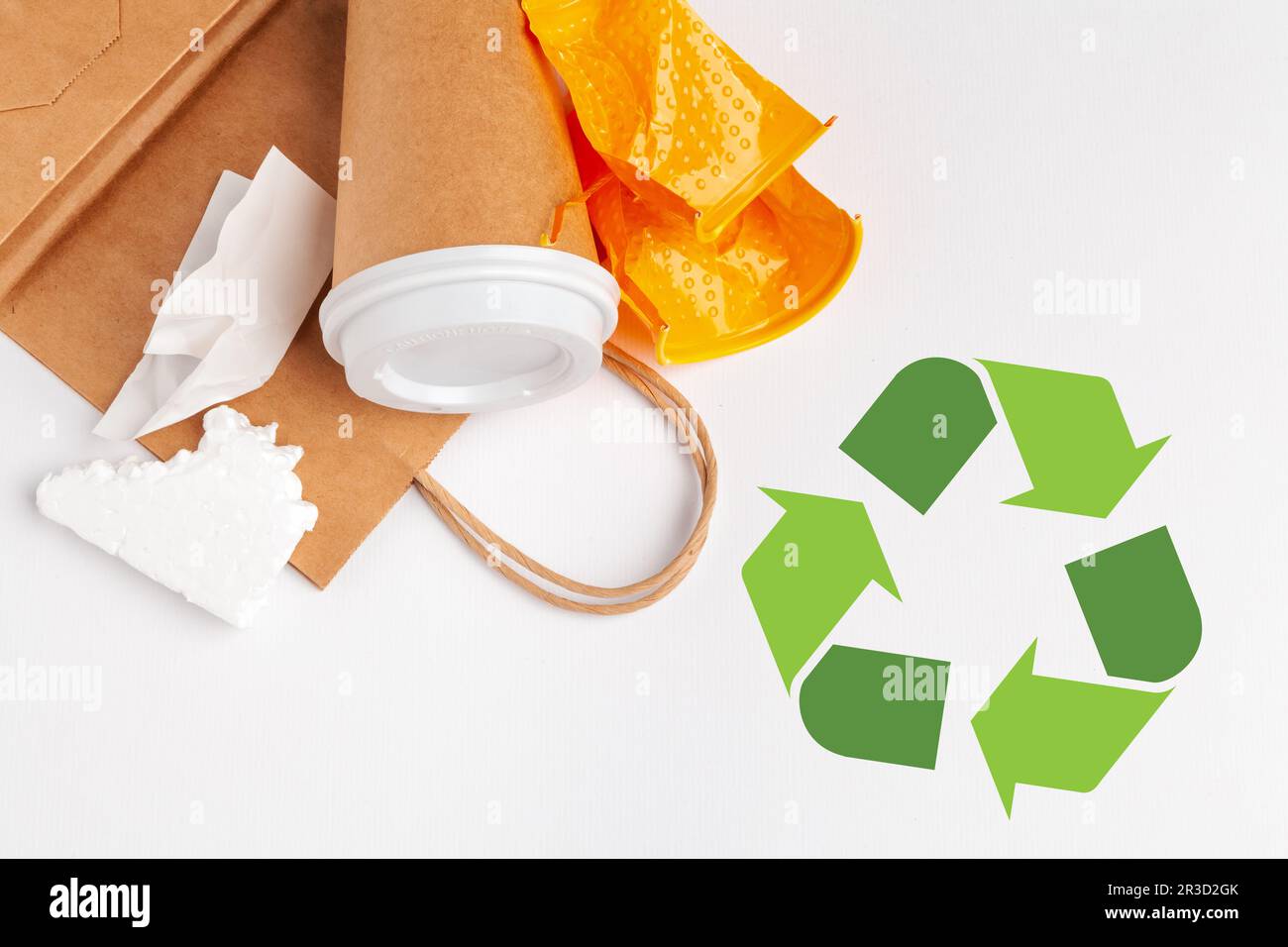 waste recycling eco symbol with garbage disposal on table background ...