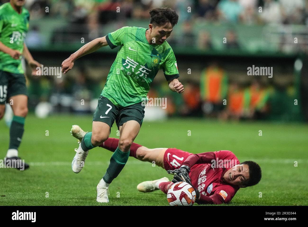 Beijing, China. 23rd May, 2023. Beijing Guoan's Kang Sang-woo (L) vies ...