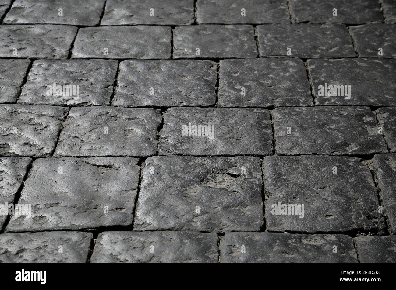 Antique slate blocks pavement on the streets of Enna in Sicily, Italy ...