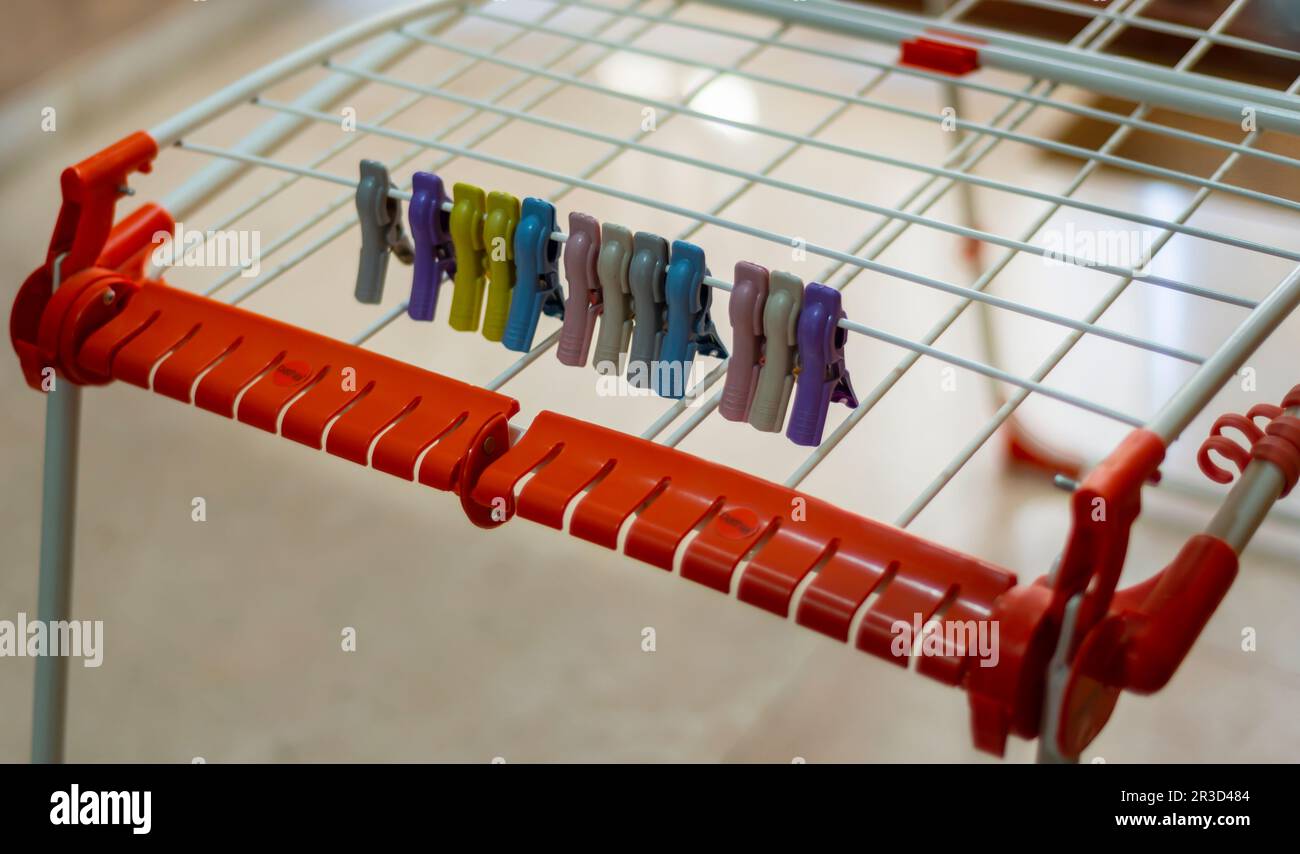 Multi-colored clothespin / clothes peg on a foldable / collapsible ...