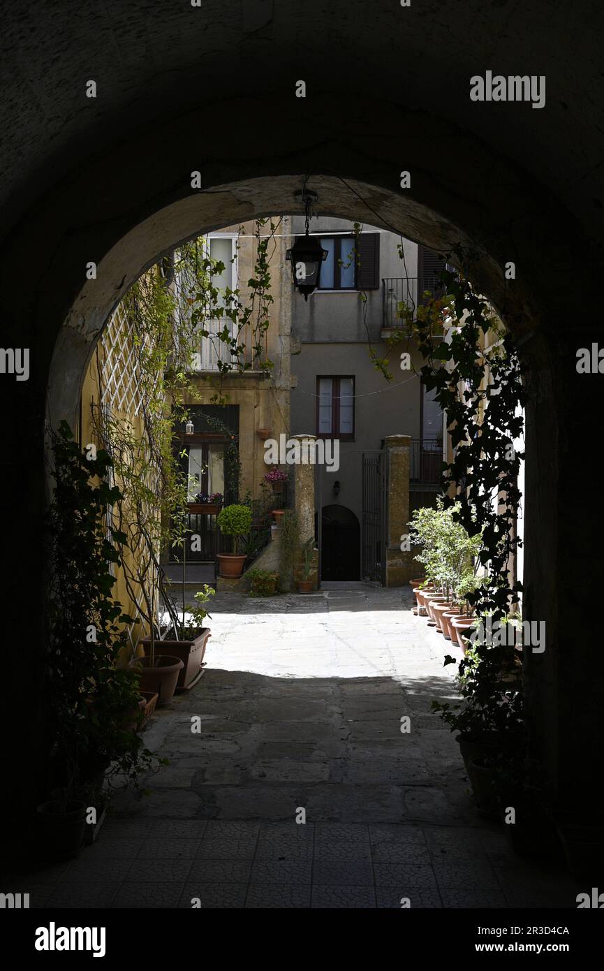 Arched cityscape with view of old medieval houses in Enna Sicily, Italy ...