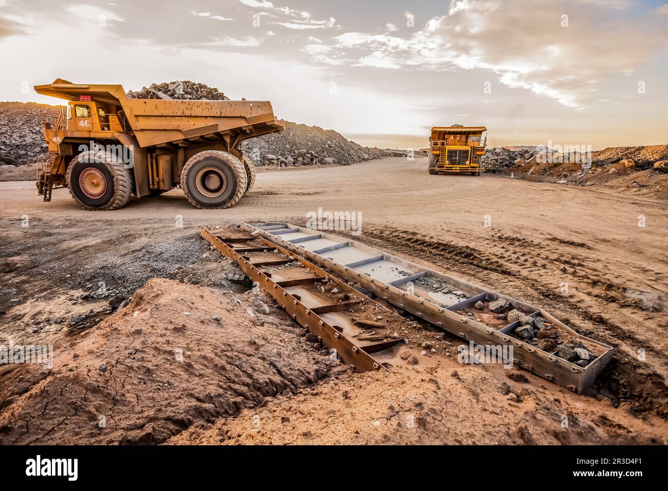 Mining dump trucks transporting Platinum ore for processing Stock Photo ...