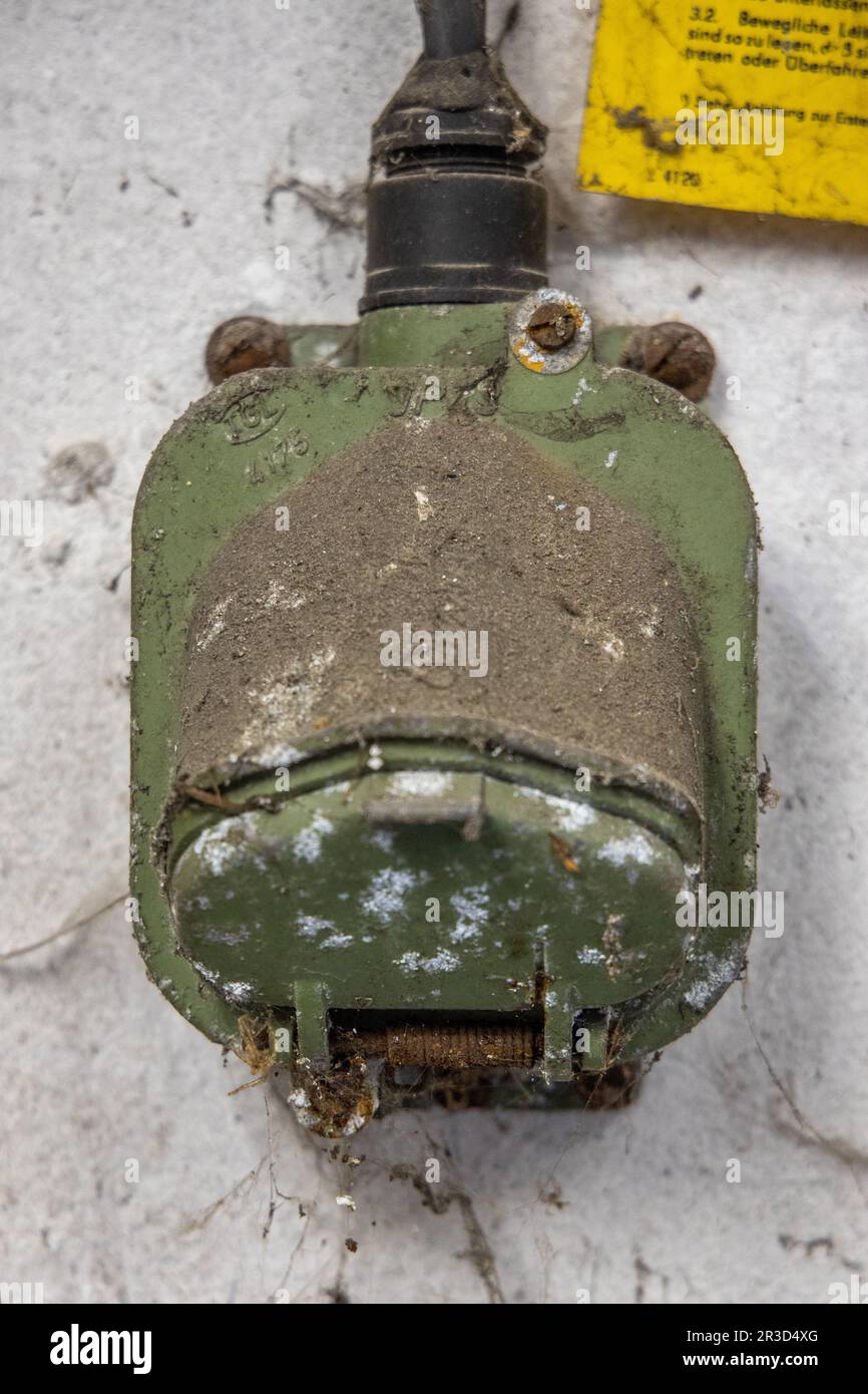 Old power socket metal collar socket GDR Stock Photo - Alamy