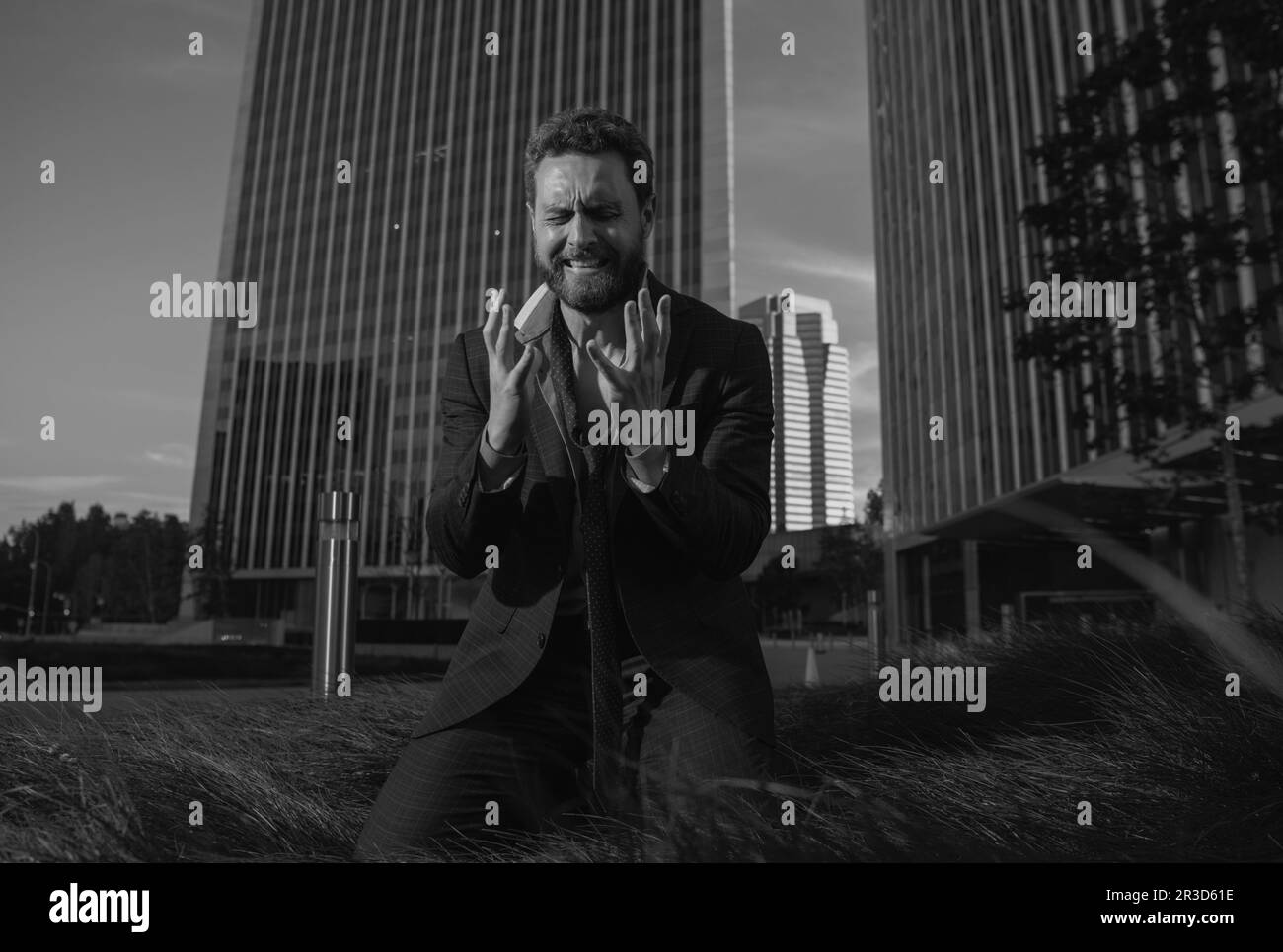 Business man lost in depression crying sitting on street suffering ...