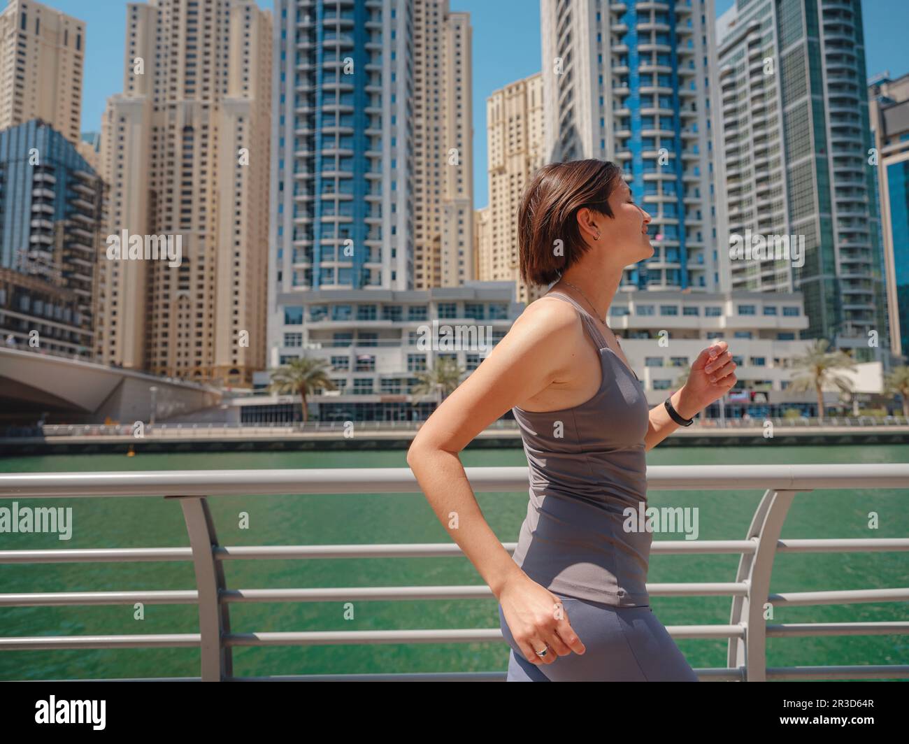 City Running - asian woman runner , Dubai marina urban scene in ...
