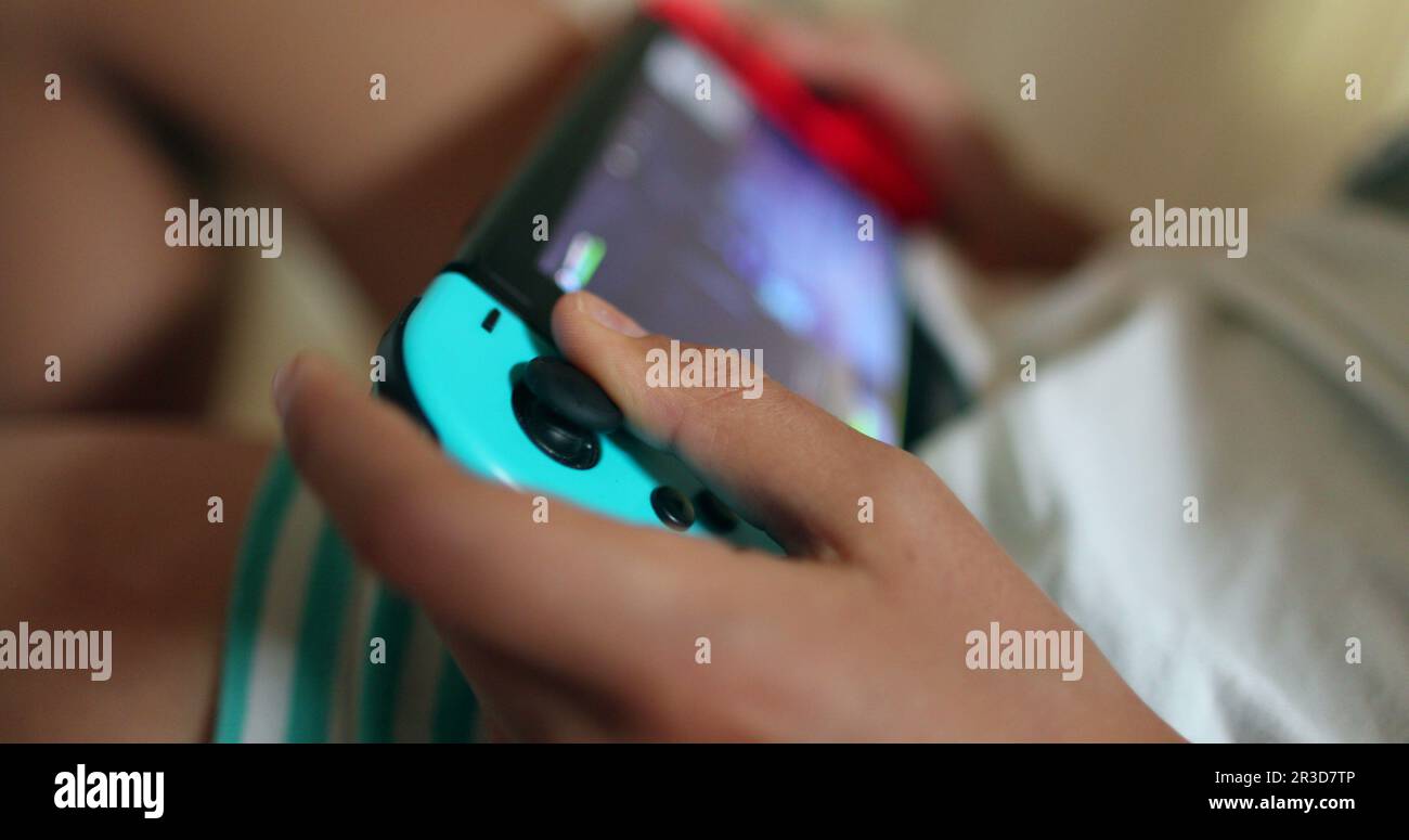 Child playing game on device. Young boy absorbed addicted to video-game ...