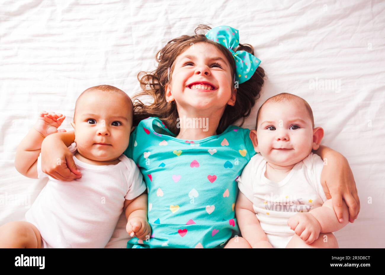 The little girl and babies have a happy childhood Stock Photo - Alamy