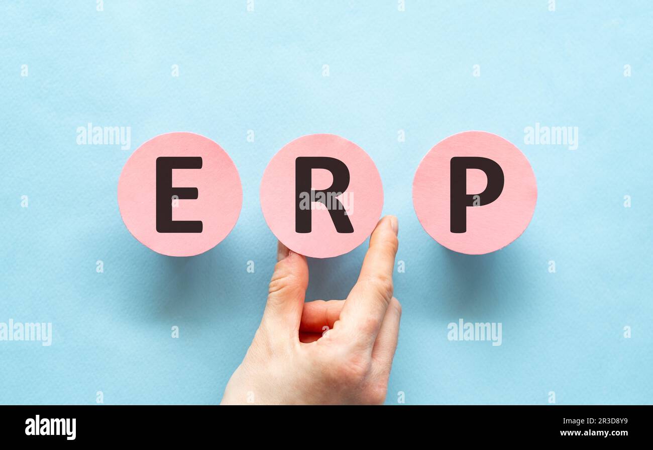 ERP text on a pink sticker on blue background. Enterprise Resource ...