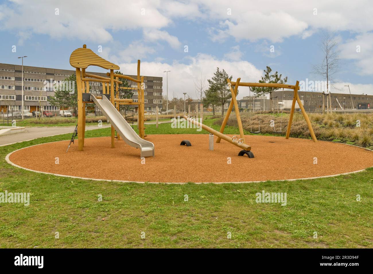 a playground area with swings, slides and slides in the middle part of ...