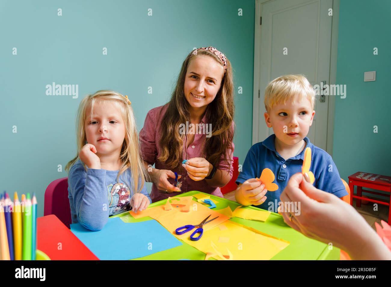Children and tutor study together at the creative school Stock Photo ...