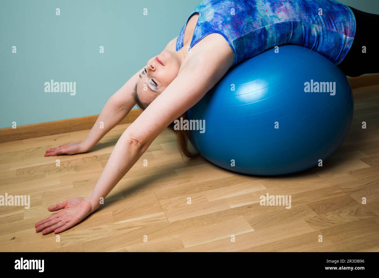 Self relaxation time at home on blue fitball Stock Photo - Alamy