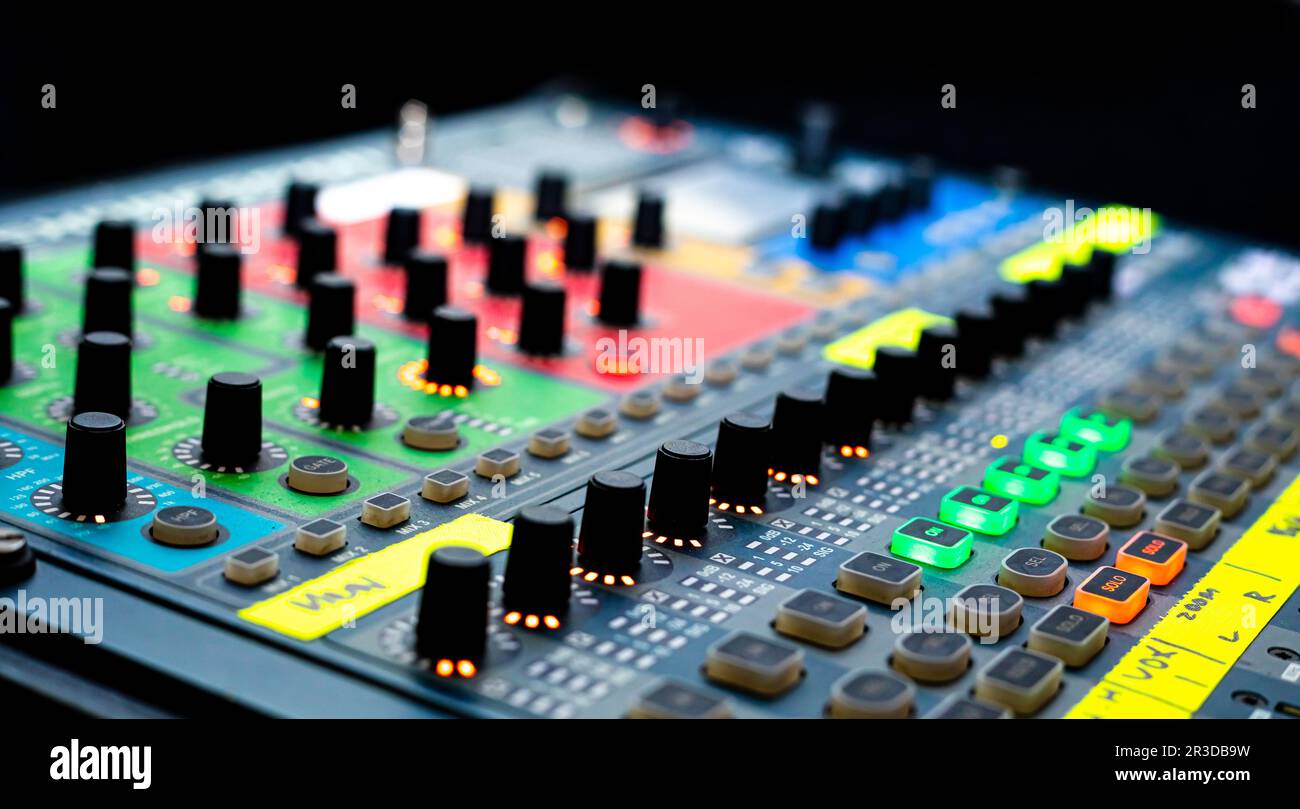 Sliders and buttons on Audio Mixing Desk at live event Stock Photo - Alamy