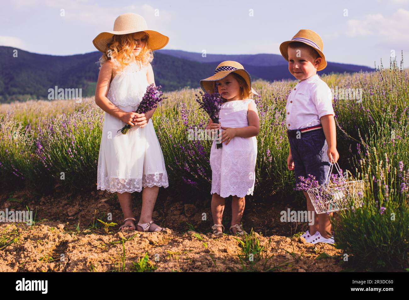 Three adorable kids, brother and two sisters Stock Photo - Alamy